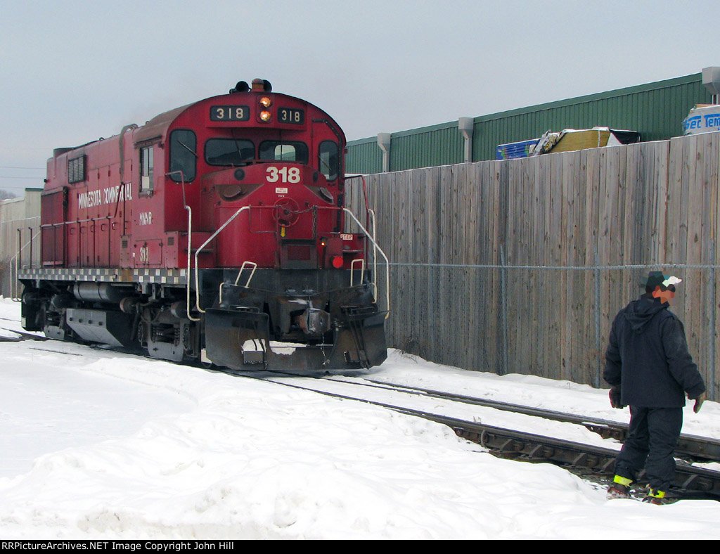 110105015 MNNR 318 Rolls Past Amtrak Midway Station